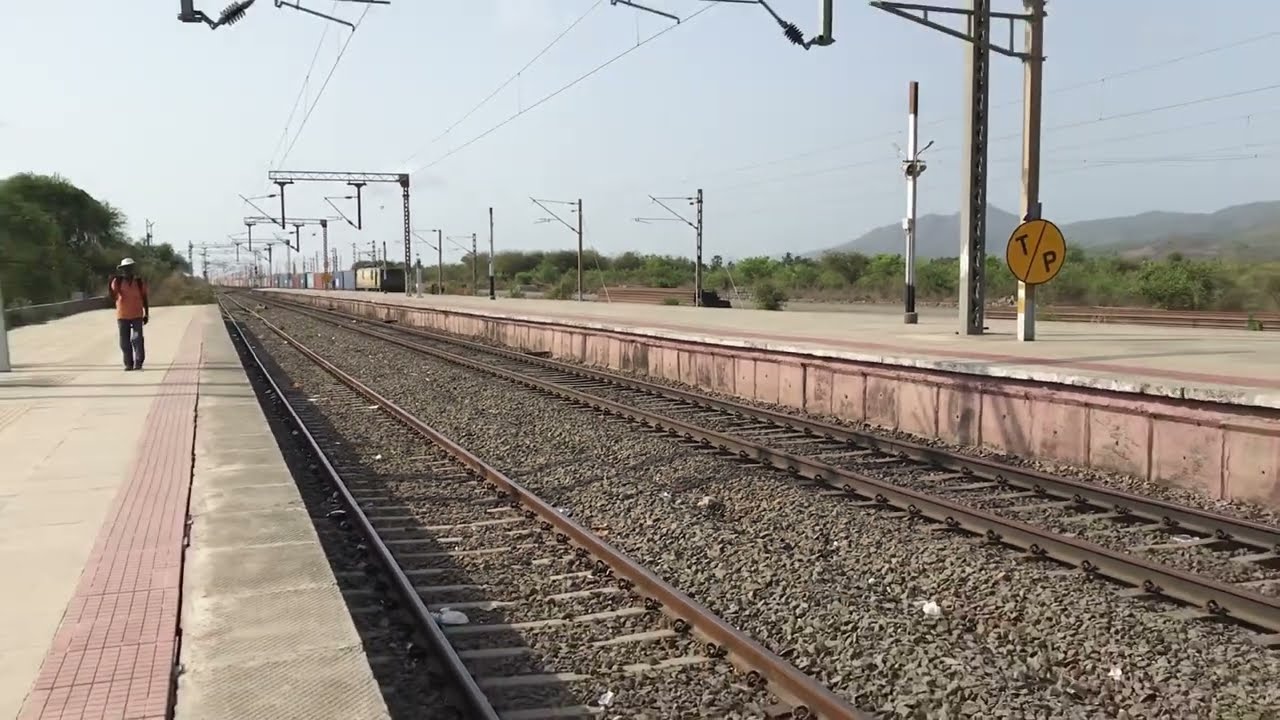 Goods train of Indian Railway crossing Kelve road - YouTube