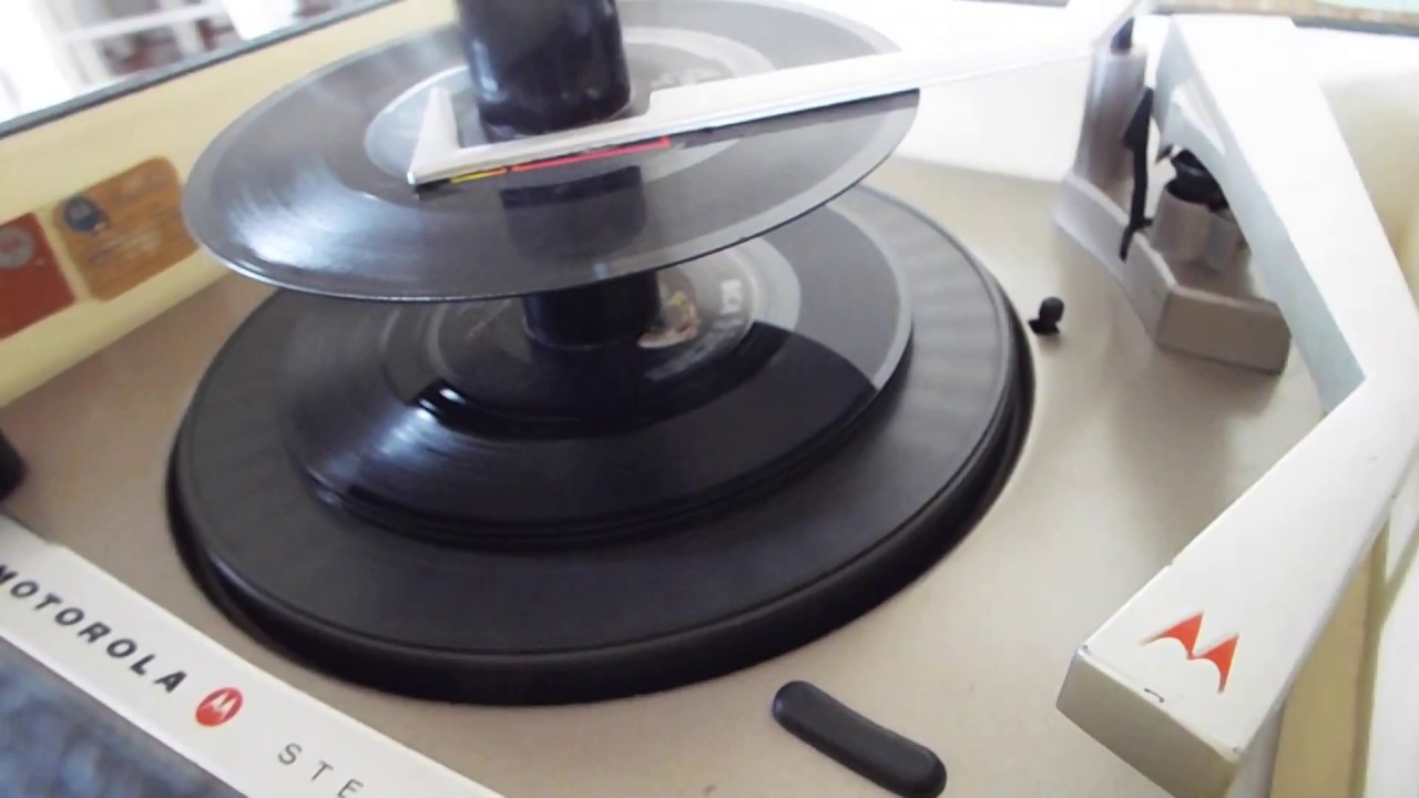 Motorola 4 speed automatic record player playing a stack of 45's - YouTube