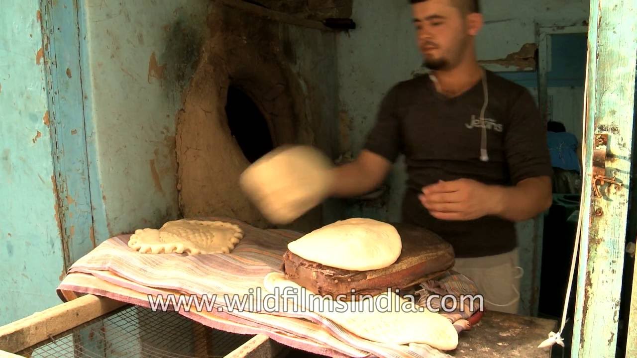 How an Afghani bread roti is kneaded and prepared for the clay oven ...