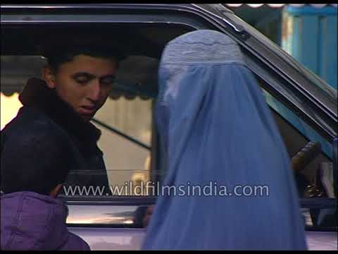 Burqa clad Afghan women beg in Kabul