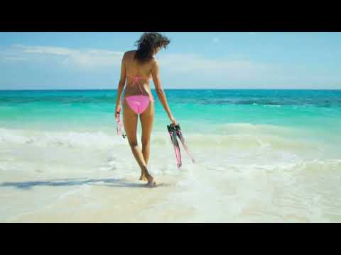 pink bikini girl walking on beach