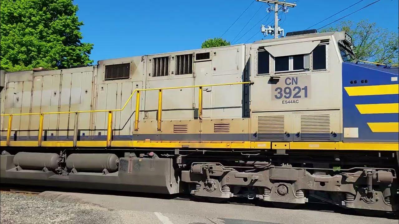 CN 2851, 3921 Westbound train with QTTX flat car, UNPX tank hopper, NS NOKL auto carrier, LSRC ...