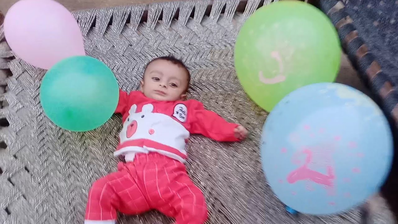 Baby Muhammad playing with colorful balloons - YouTube