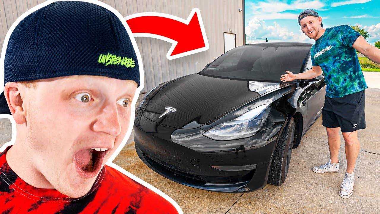 I BOUGHT MY CAMERAMAN A TESLA! - YouTube