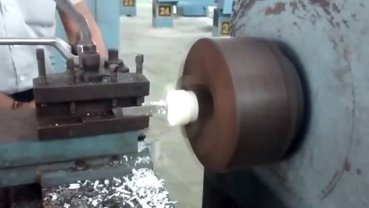 Turning operation on lathe to make teflon rotor - YouTube