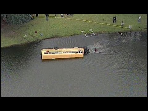 School bus crashes into pond - YouTube