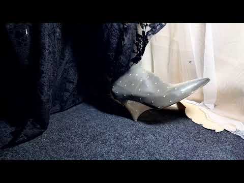 ASMR close-up of high heels worn over pantyhose.
