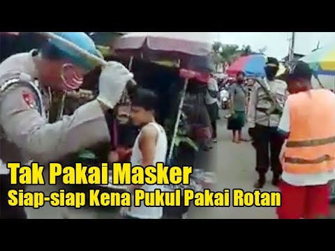 Viral Anggota Polisi Pukul Pantat Warga dengan Rotan Bagi yang Tidak Pakai Masker