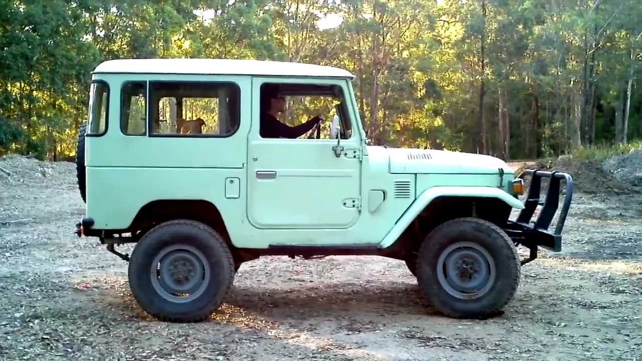A cool chick driving a cool FJ40 with a cool dog - YouTube