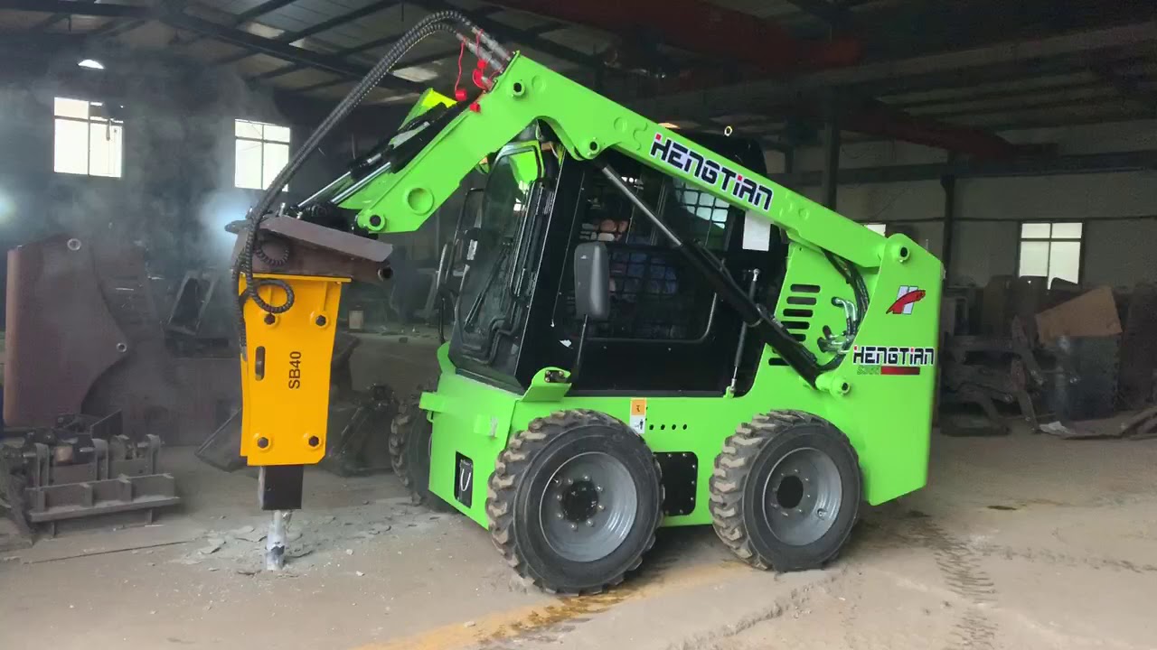 skid steer loader working with hydraulic breaker - YouTube