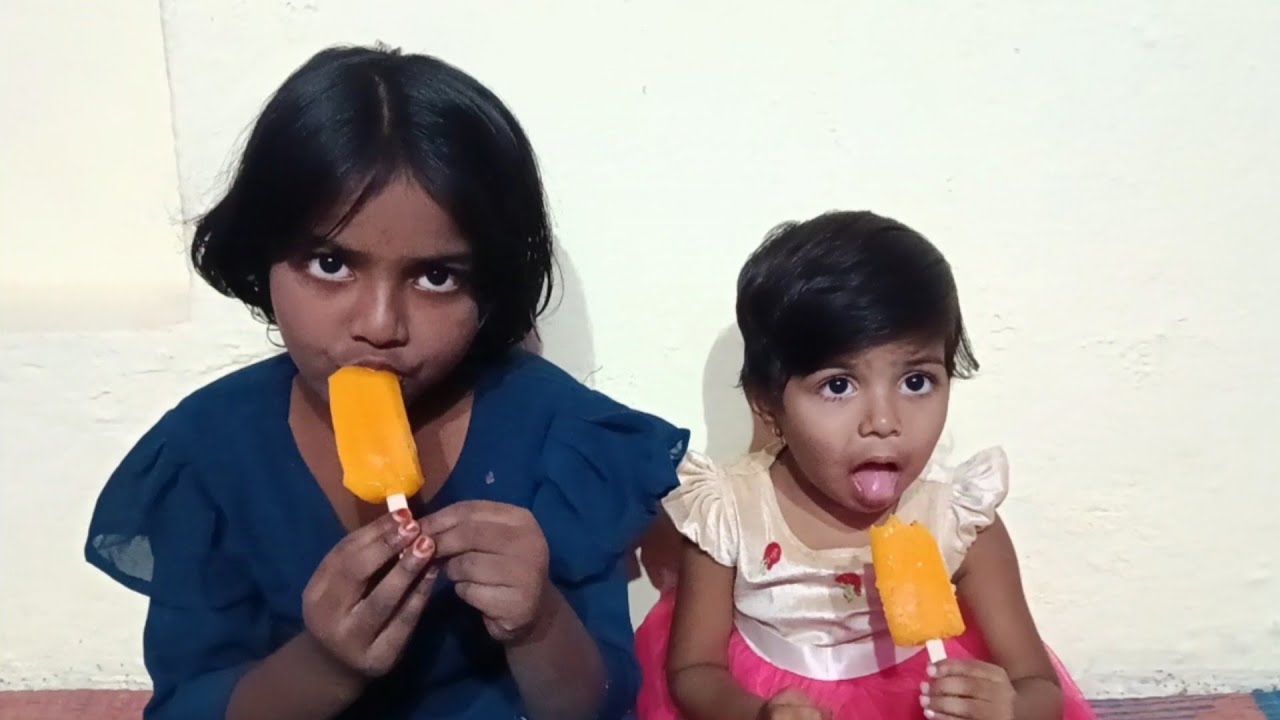 kids eating orange candy stick ice cream.. - YouTube