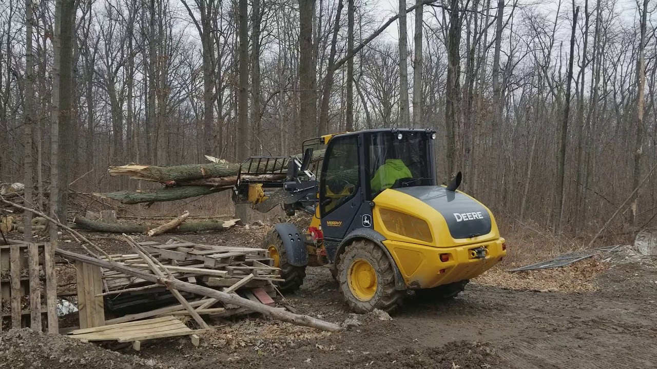 Wheel loader moving logs - YouTube