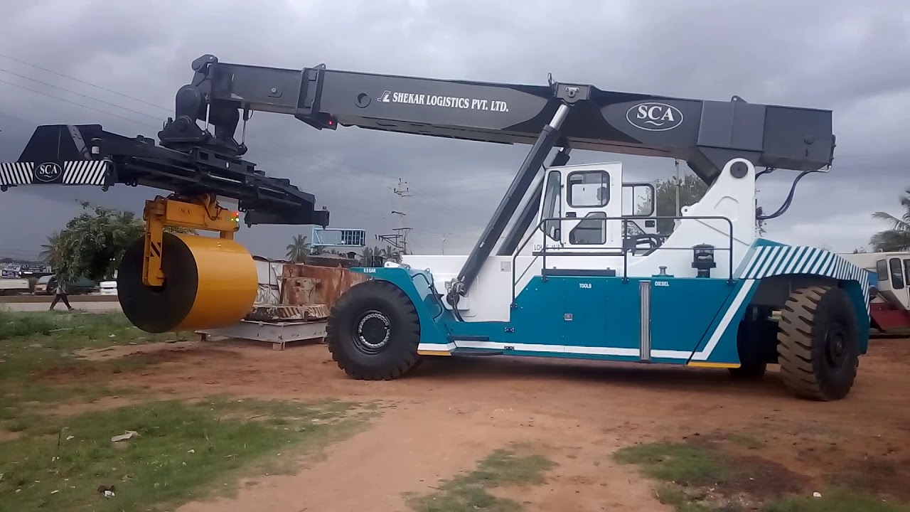 SCA heavy equipment reach stacker with coil attachment - YouTube