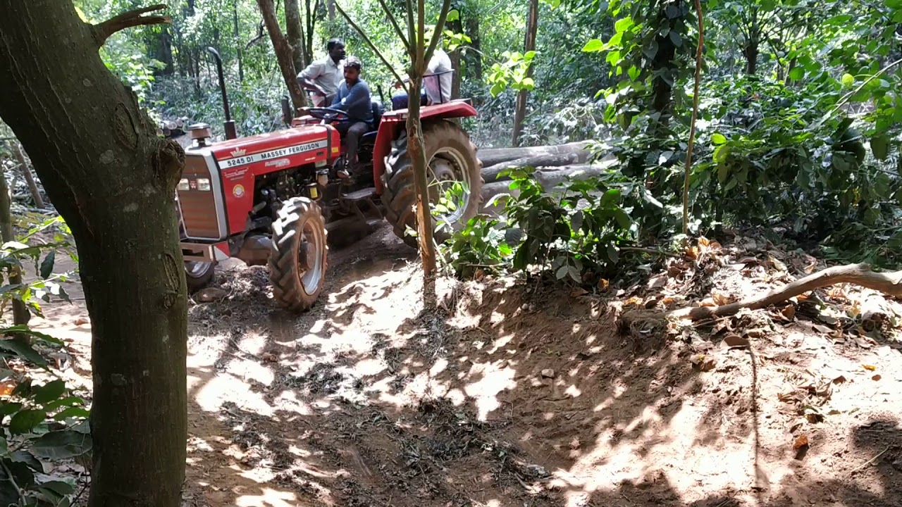 A 4*4 tractor pulling timber wood in my coffee estate - YouTube