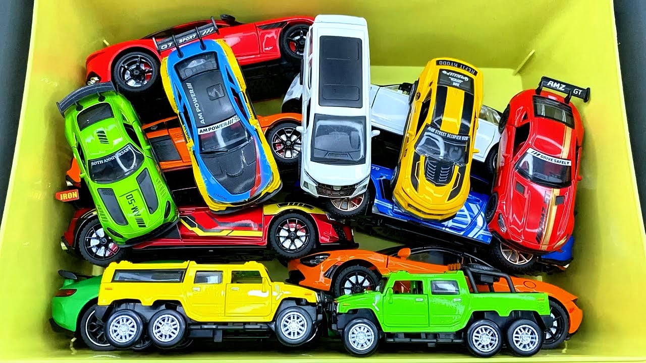 Box full of various miniature cars Peugeot, Volvo, Renault, Hyundai ...