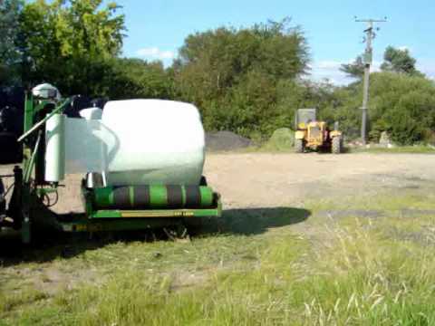 Making round bale grass silage at Shaw Farm - YouTube