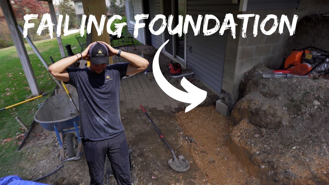 FIXING A FAILED RETAINING WALL- Foundation failing - YouTube