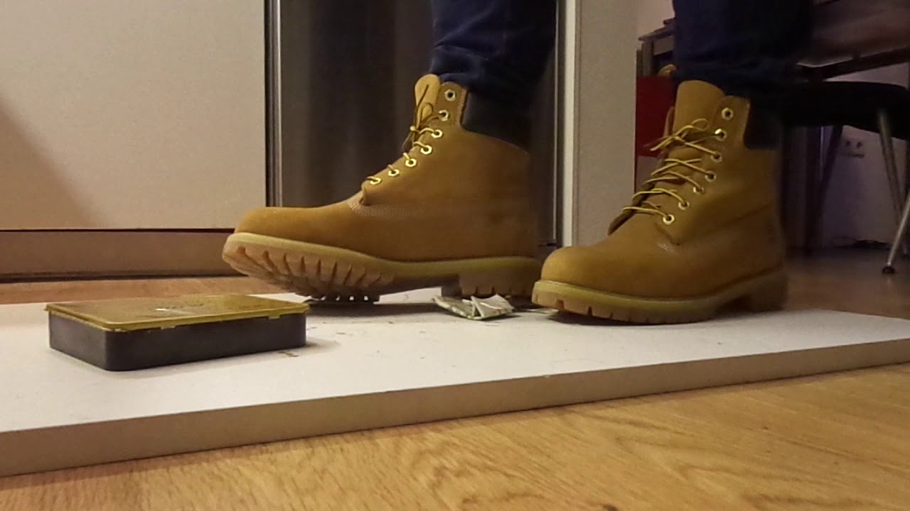 Timberland Boots stomp, trample and destroy 2 old vintage tin cans ...