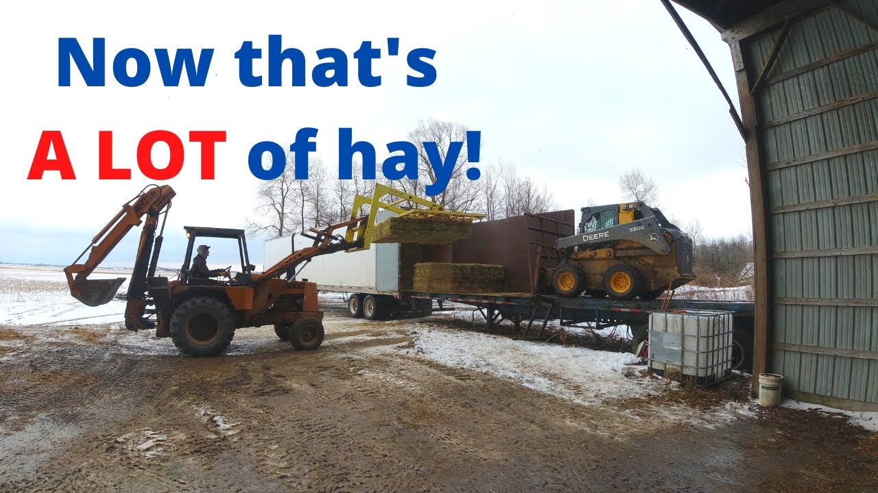 Loading hay into a semi trailer and wrenching on a 7550 John Deere ...