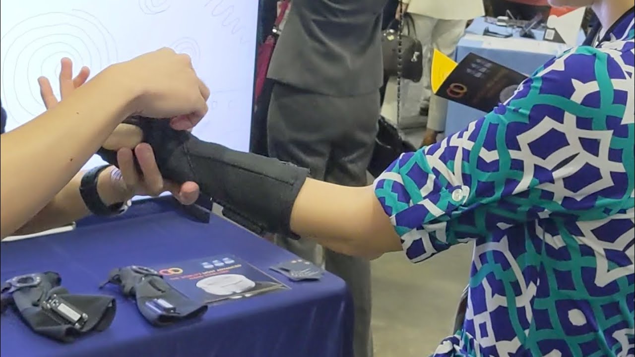 Anti tremor glove by Gyrogear for Parkinsons Disease - YouTube