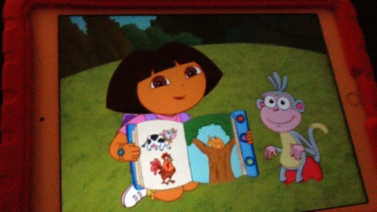 Dora Has A Sound Book On Her Hands And Boots Is Sitting On The Right ...