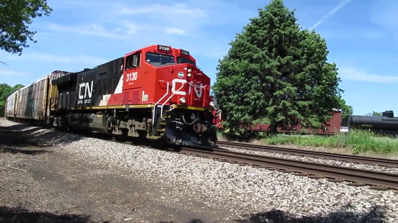 CN 3130 pulls an Eastbound auto carrier, container freight train, CN 3201 in middle at Vicksburg ...