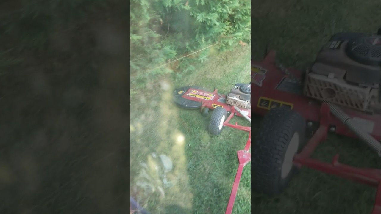 Swisher postmaster mowing under trees - YouTube