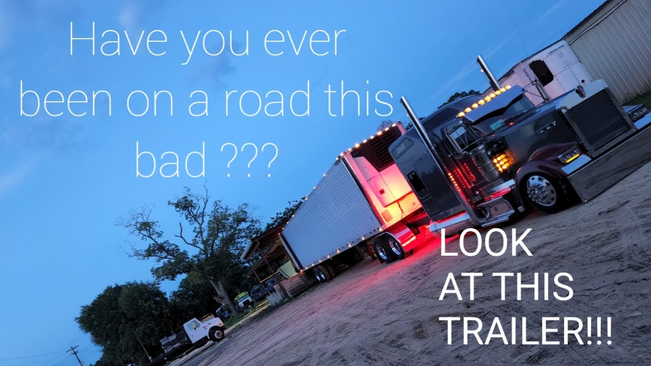 One messed up trailer from dirt road|loading off clay road|farm ...