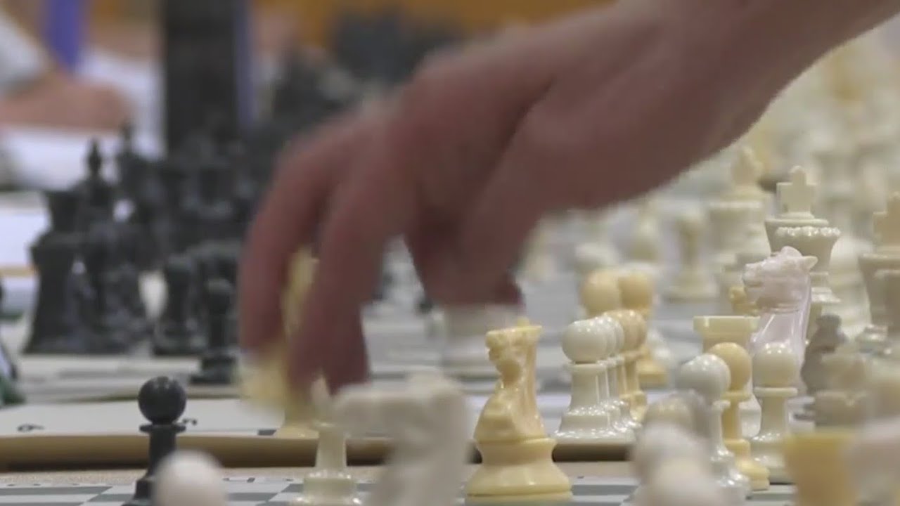 Chess grandmaster plays 55 kids at once - YouTube