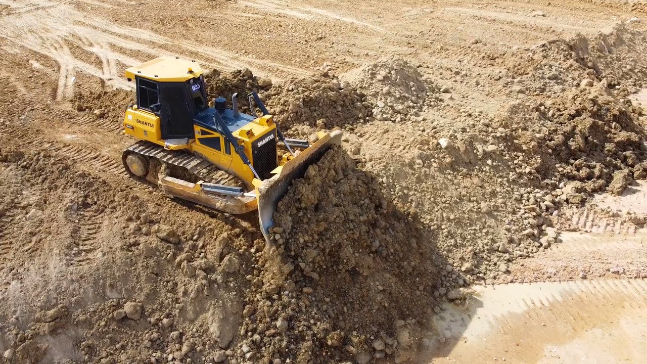 Skills Operator Shantui Dozer Pushing Gravel With Dump truck Unloading ...