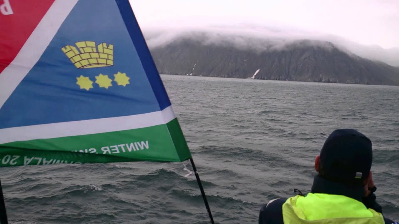 Bering Strait Swim start - flags in the wind - YouTube