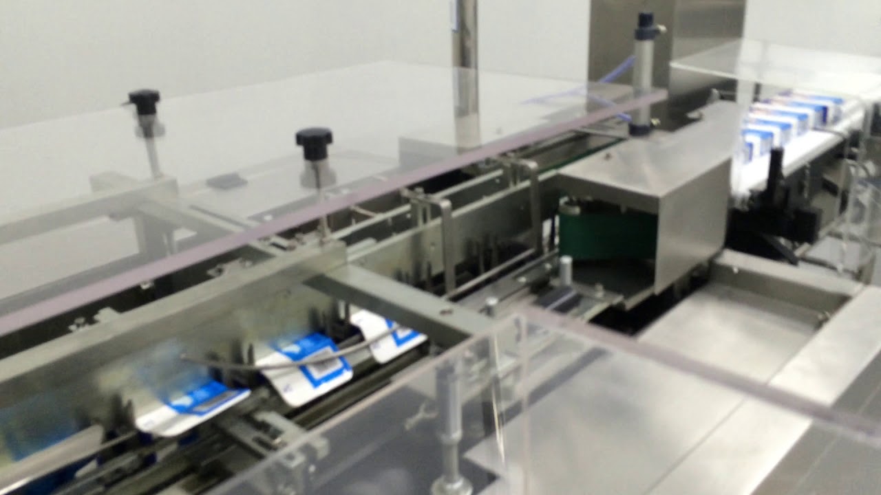 automatic box filling and sealing machine for small bag product - YouTube