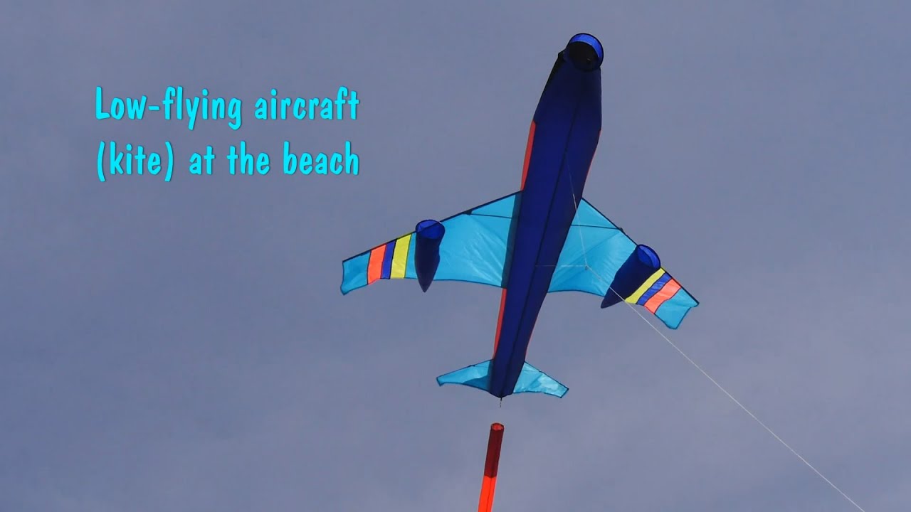 Low-flying aircraft kite over the beach - YouTube