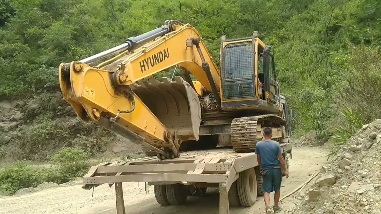 Excavator loading - YouTube
