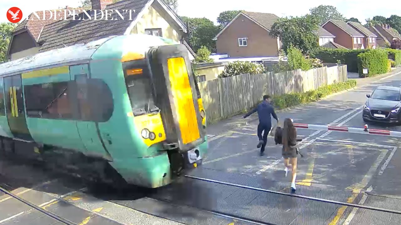 'Reckless' pedestrians seconds away from being hit by train in ...