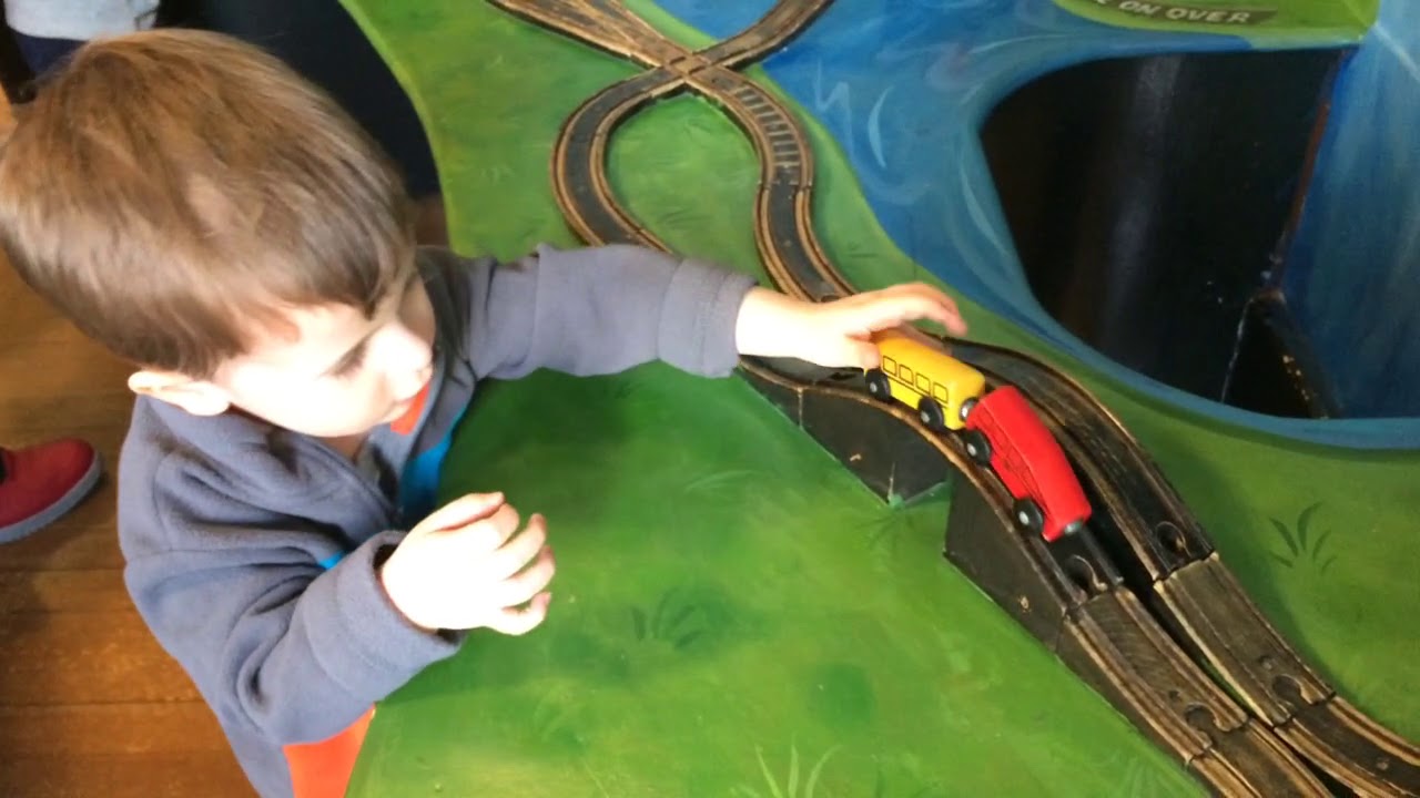Playing with trains at KidCity museum - YouTube