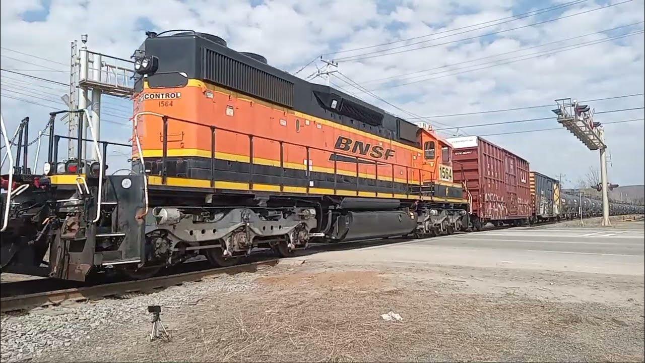 Big surprise, ONR 214 arriving at highway crossing with units ONR 2123,2122,2124,BNSF 1563 ...