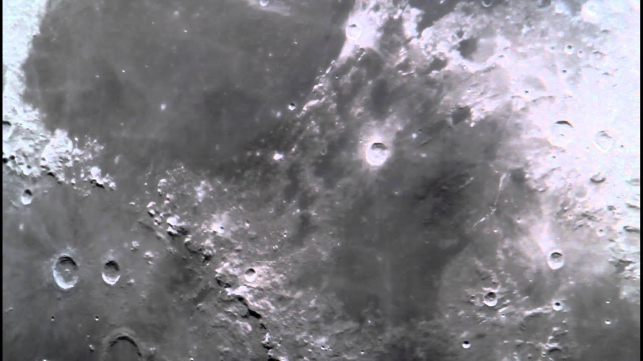 Moon through a telescope - YouTube