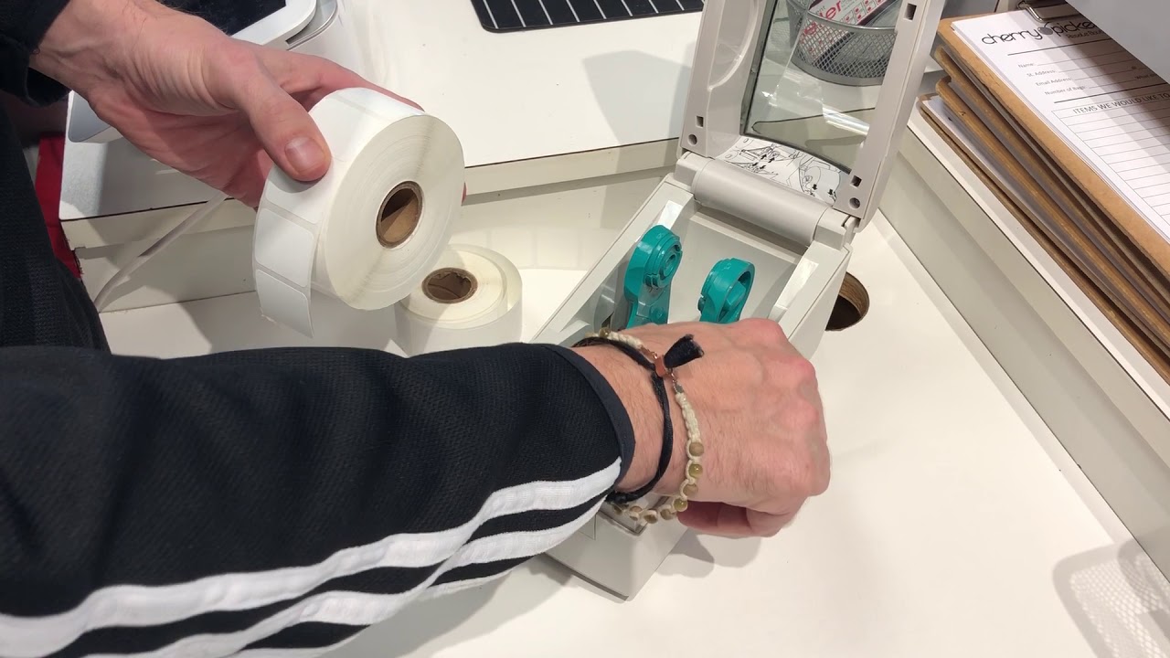 How to replace the stickers in the zebra label printer - YouTube