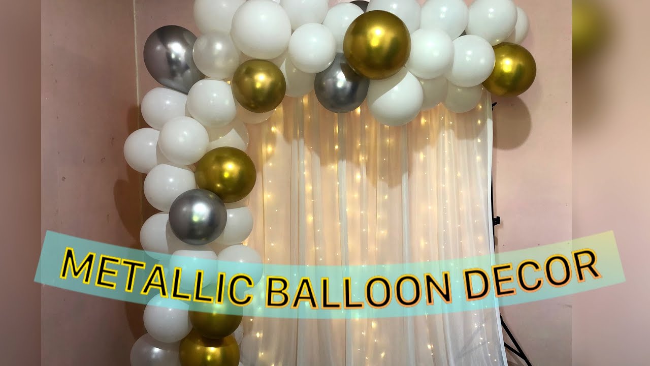 Metallic balloon backdrop with curtain lights - YouTube
