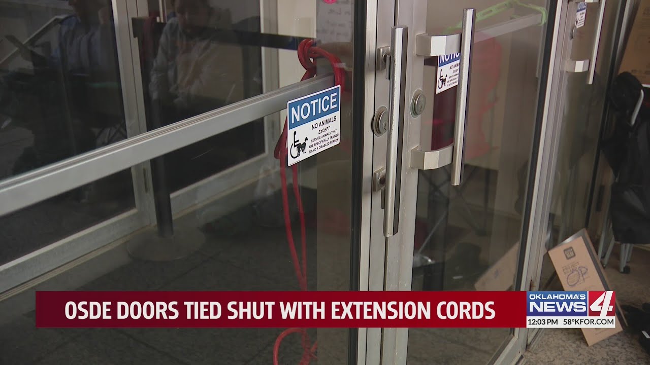 OSDE doors tied shut with extension cords - YouTube