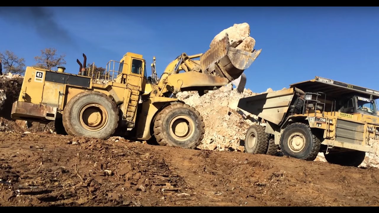 Caterpillar 992C Whell Loader Loading Rocks In 775D Dumper - YouTube