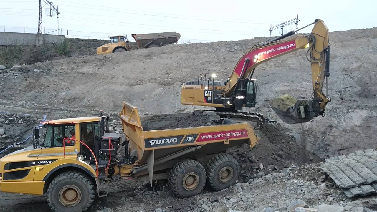 Cat 336 E L HDHW with slopebucket grading slope, and loading ADT's ...