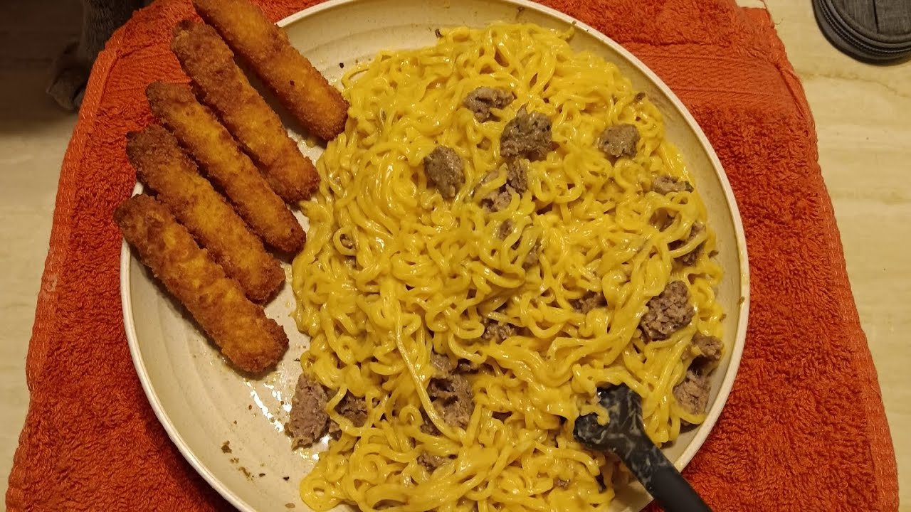 fish sticks and ramen noodles with chopped up hamburger paties and ...