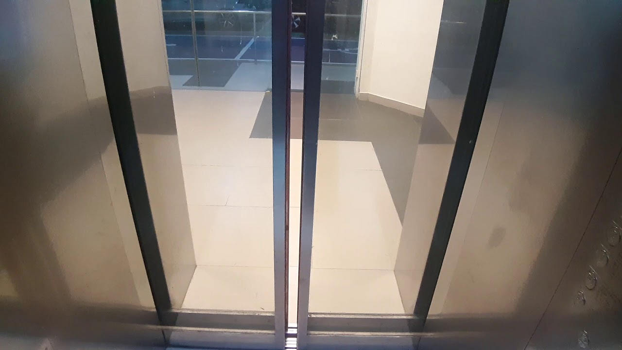 Toshiba traction glass lifts/elevators Bugis Junction, Singapore - YouTube