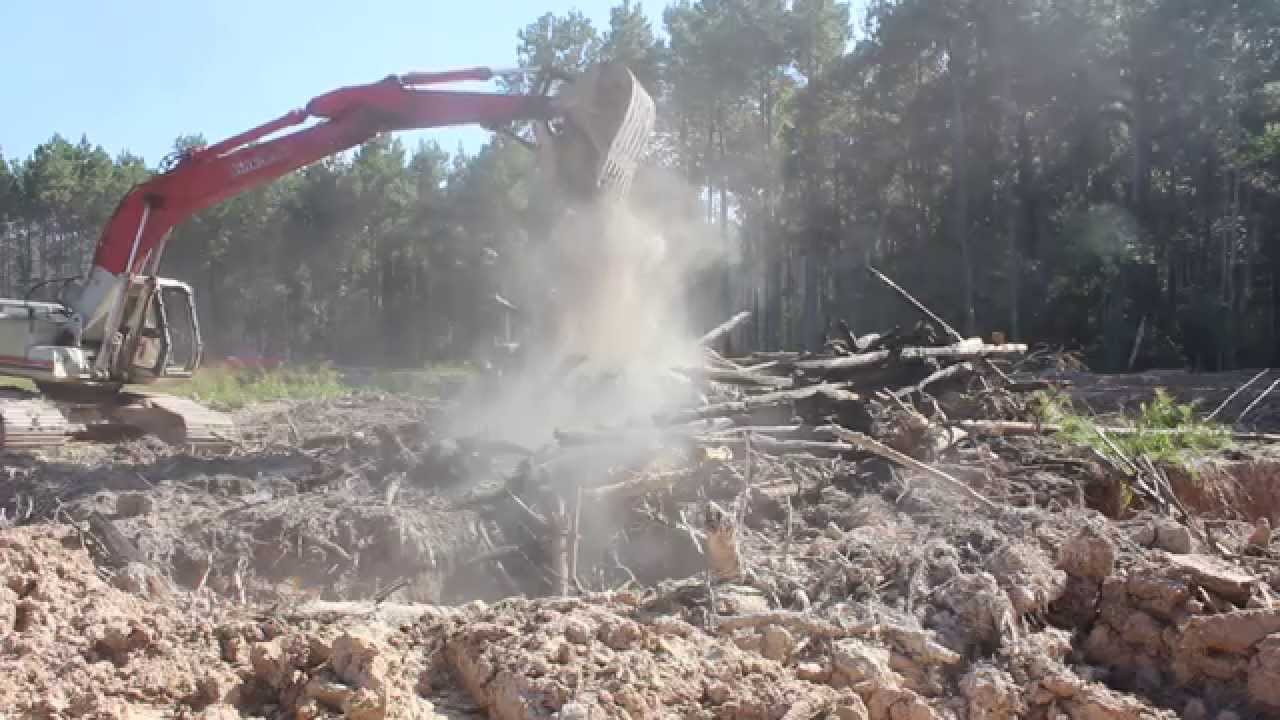 Organizing Burn Piles with Excavator - Link Belt 3400 Quantum - YouTube
