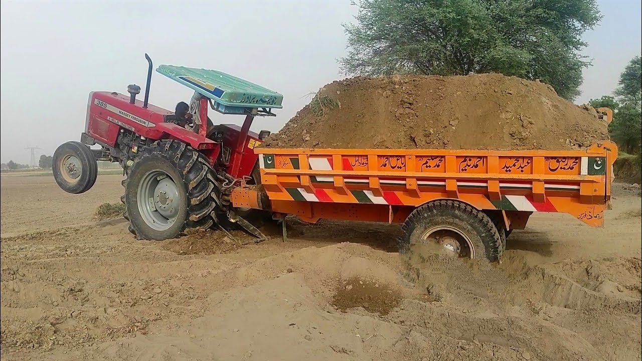 MF385 Tractor & Trolley stuck in the mud | heavy loaded trolley - YouTube