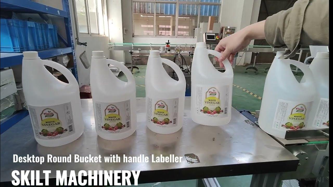 Round bucket fix position labeling machine-SKILT - YouTube