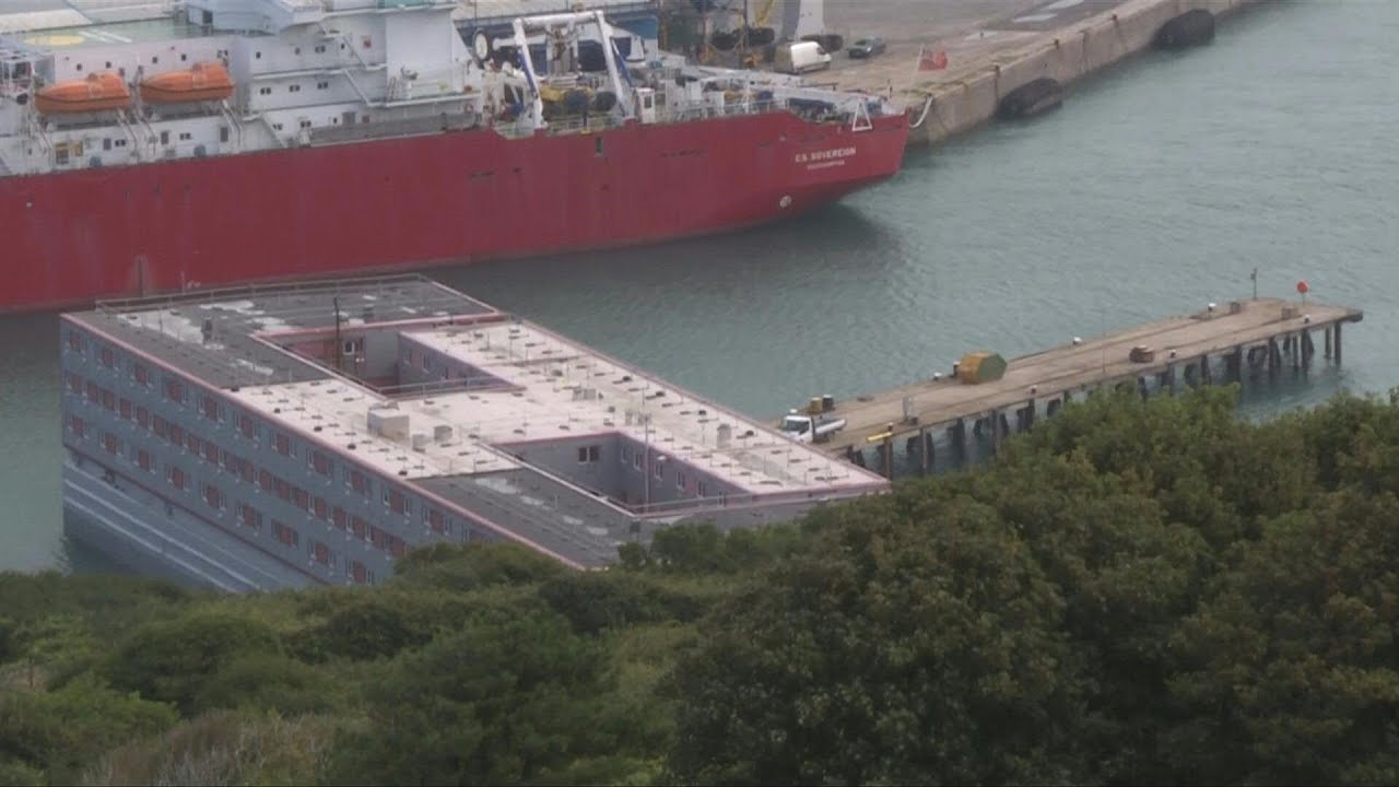 English town united in anger over arrival of asylum seeker barge | AFP ...