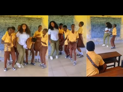 NYSC Member dancing energetically with her students while teaching them ...